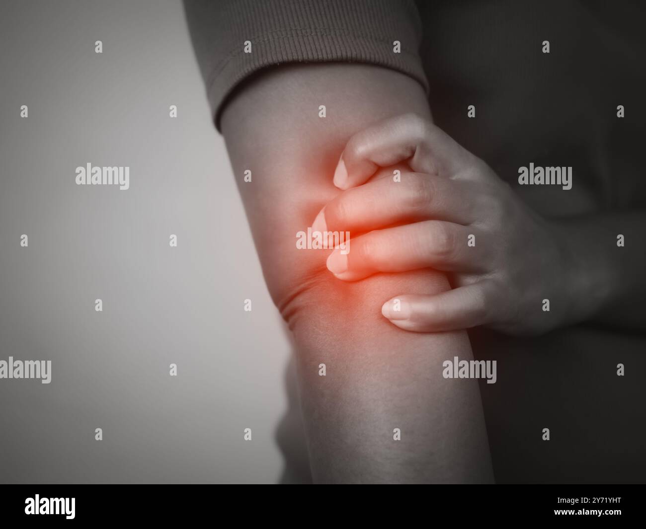 Woman with acute pain elbow on gray background, Woman having elbow ache ...