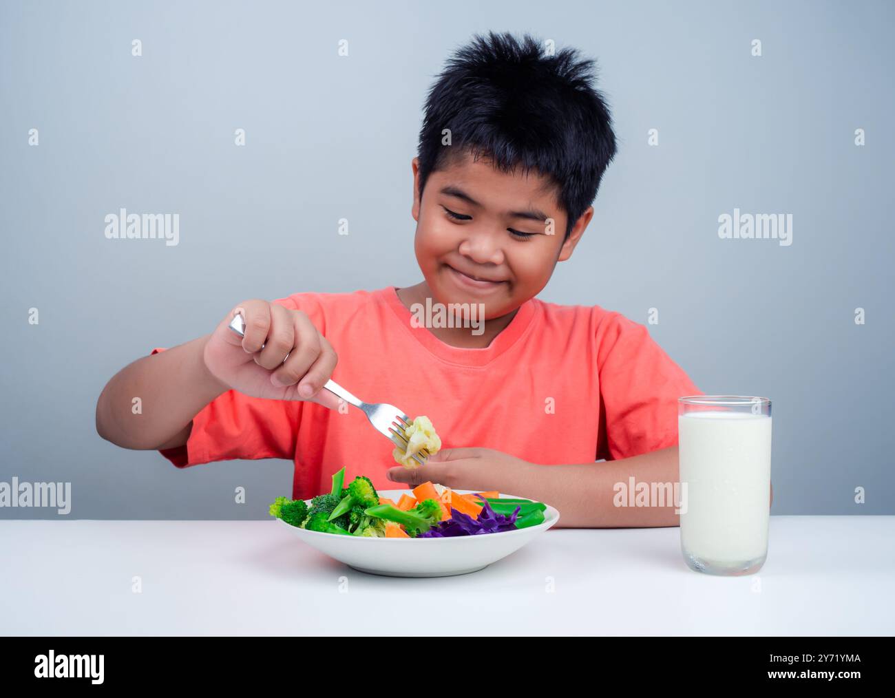 Children like to eat vegetables, Little cute boy eat healthy vegetables ...