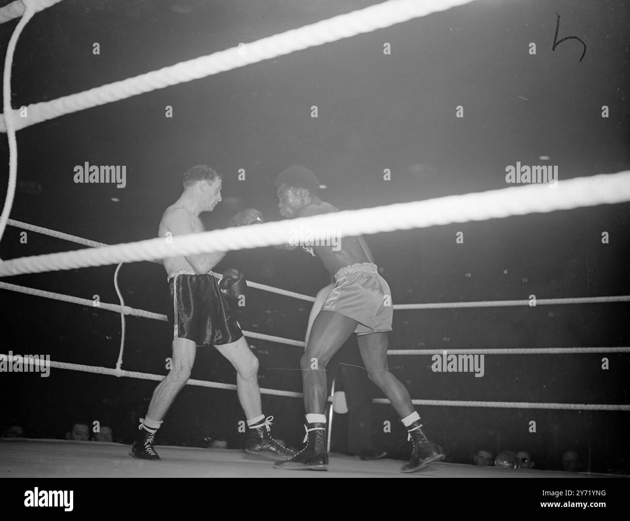 CHAMPIONS DRAW ANDERSON -MILLER FIGHT Standing toe-to-toe , CLIFF ...