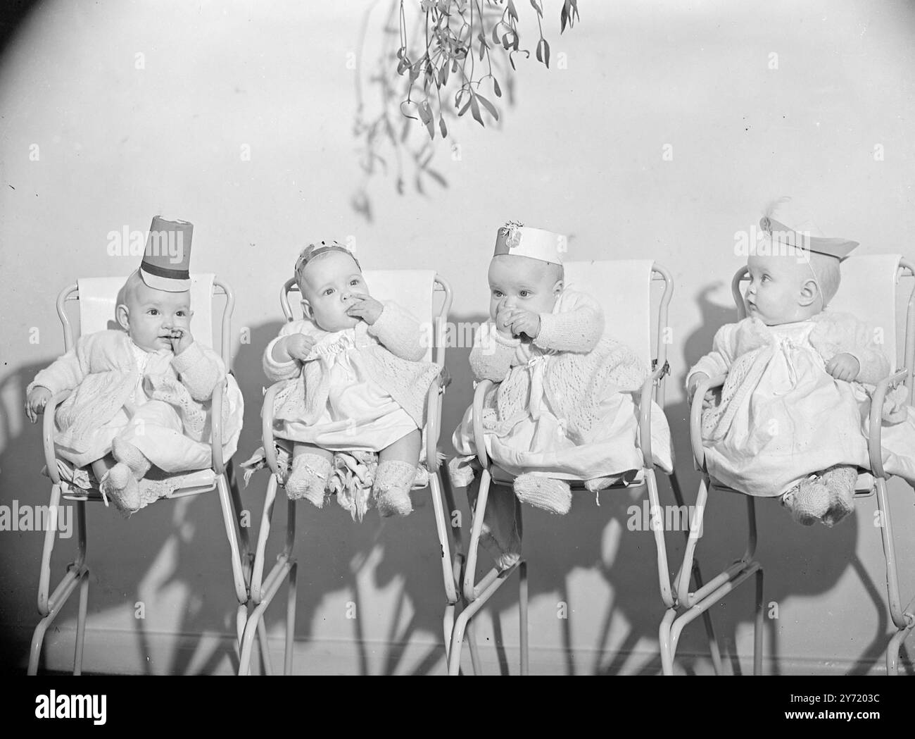 QUADS FIRST NOEL The four charming young ladies sitting coyly under the ...
