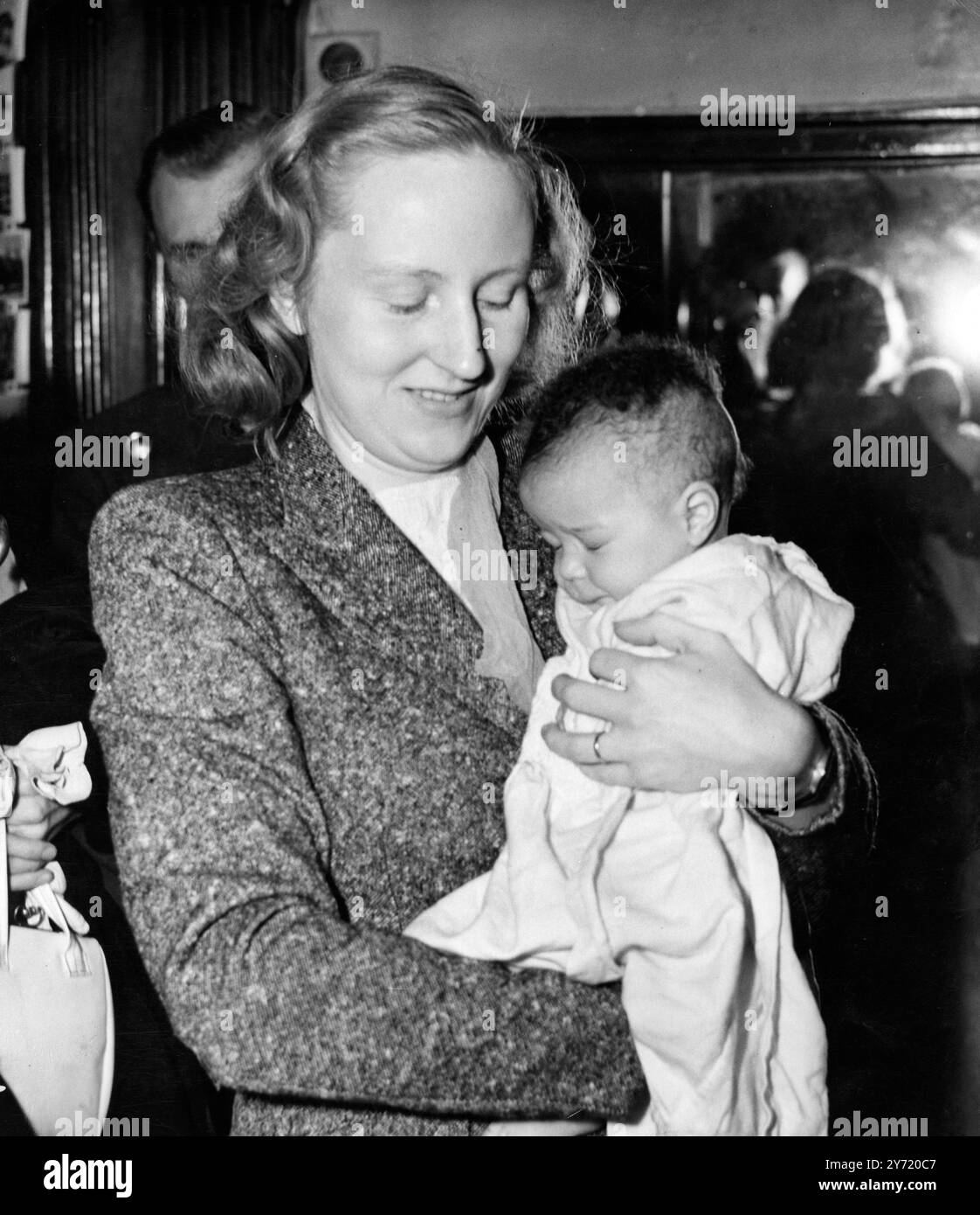 Ruth Khama and Jacqueline in London. Carrying her three month old baby ...