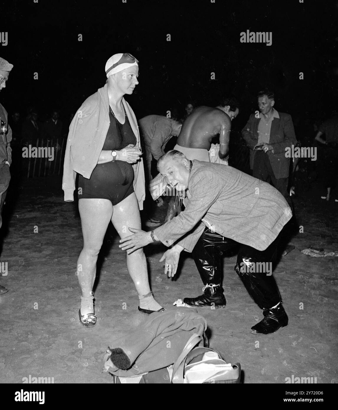 Brenda Fisher ( Great Britain ) being greased before entering the water ...