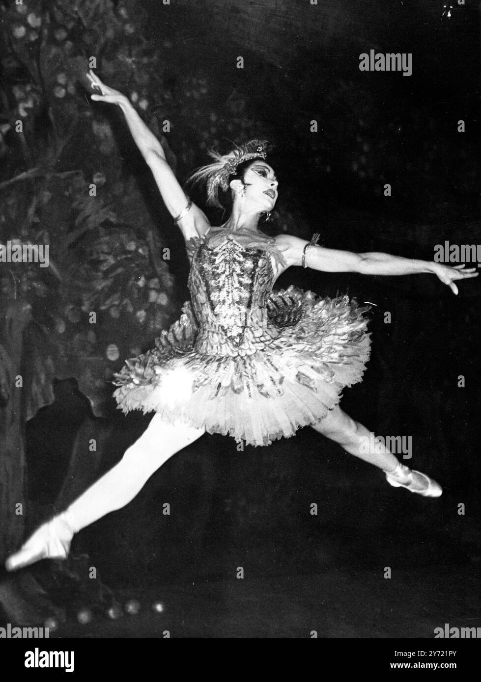Ballerina Margot Fonteyn , makes a graceful flight as " The Firebird ...