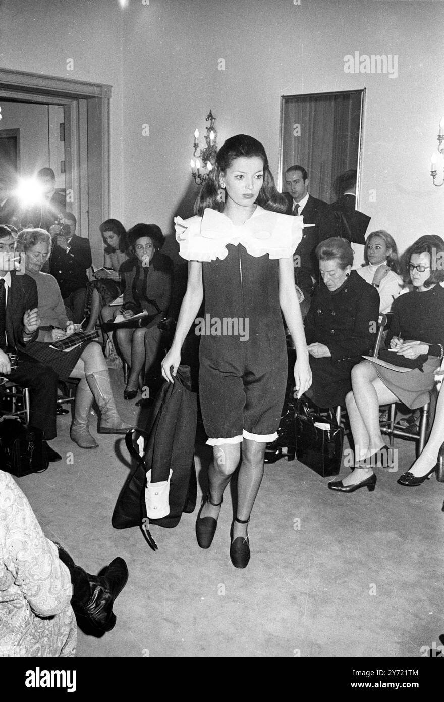 Tiziani designs The white fabric in this sports overblouse by Evan ...