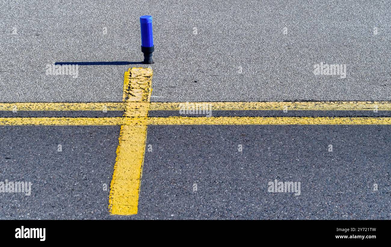 Airport sign and yellow painting in the runway or tarmac Stock Photo ...