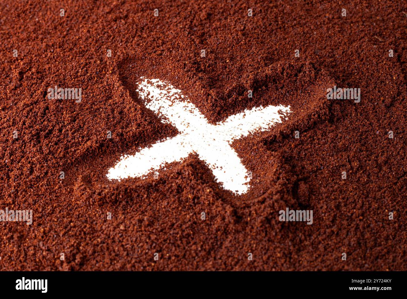 X symbol, painted in brown coffee powder Stock Photo - Alamy