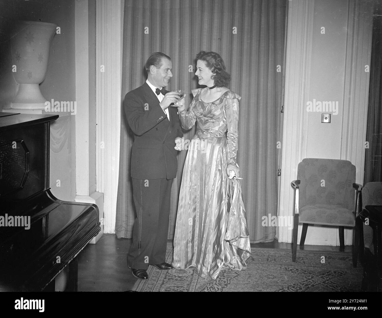Picture shows: Miss Beryl Baxter and Flight Lieut. H Sarnicky toast ...