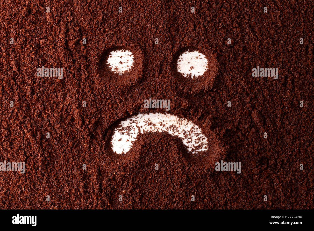 sad face symbol,painted in coffee powder Stock Photo - Alamy