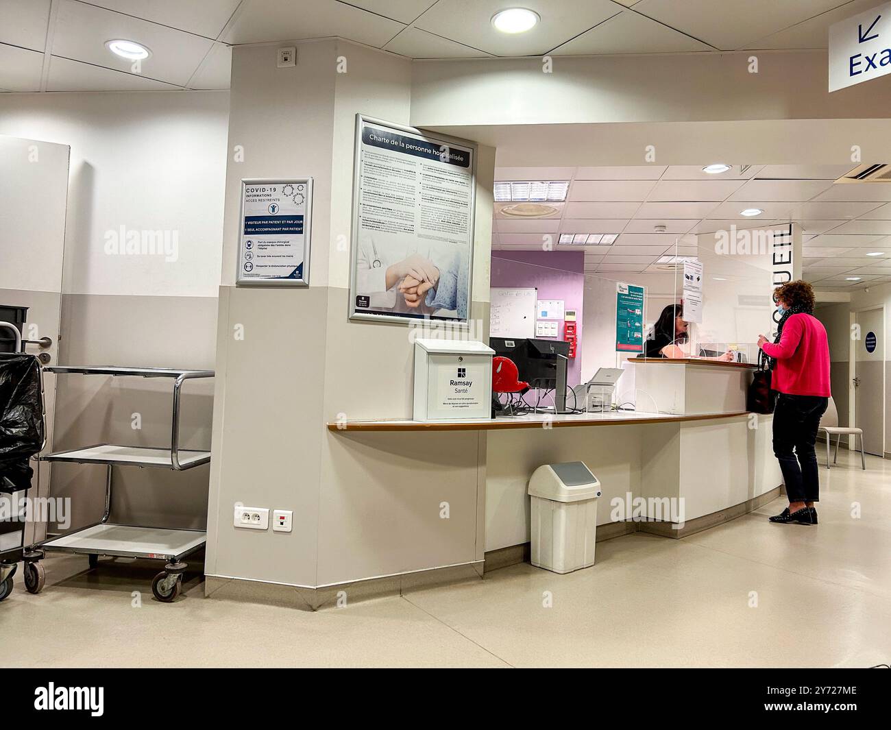 Paris, France, Woman Patient speaking to secretary, interior, hall ...