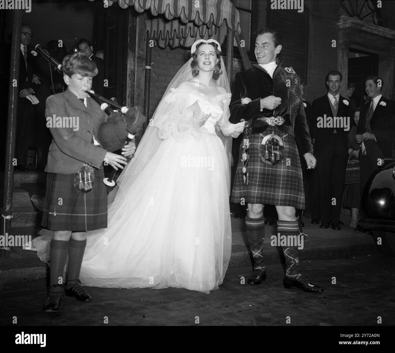 Ten year old Kim Fraser , son of Lord Lovat , greets the bride Antonia ...