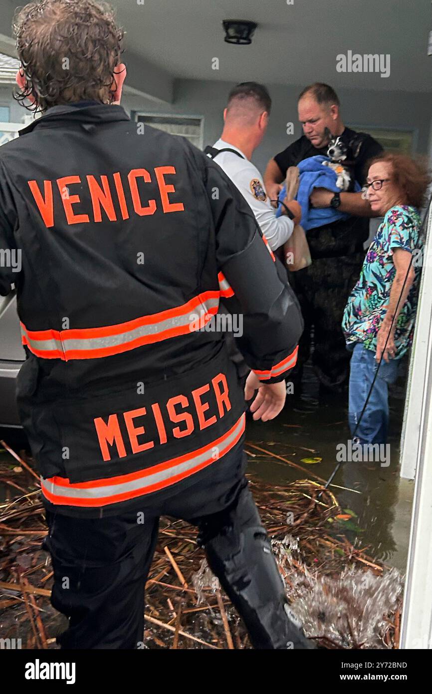 This photo provided by Venice Police Department rescue crews assist ...