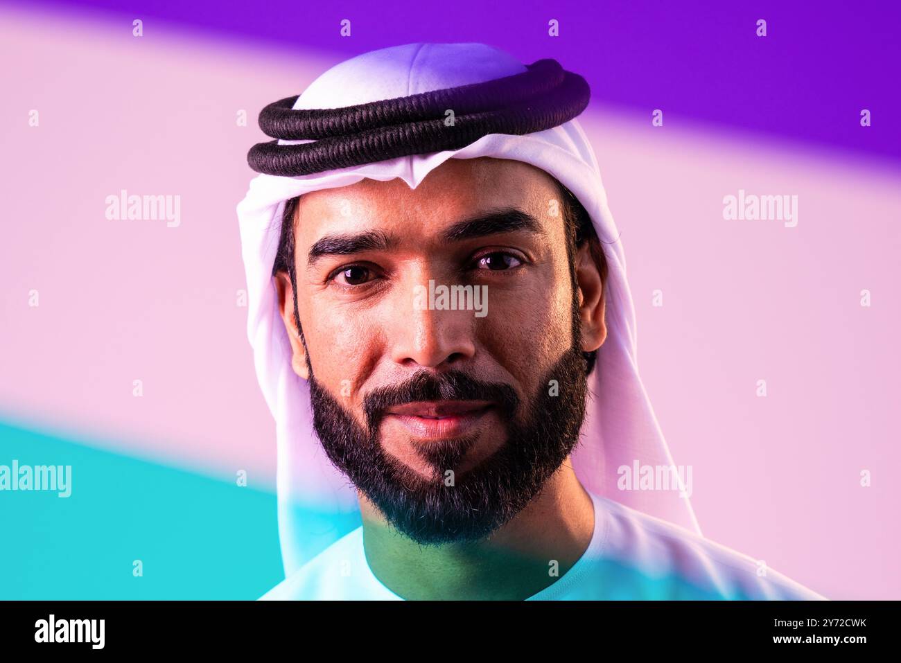 Arab businessman wearing emirati kandura portrait in studio in Dubai ...