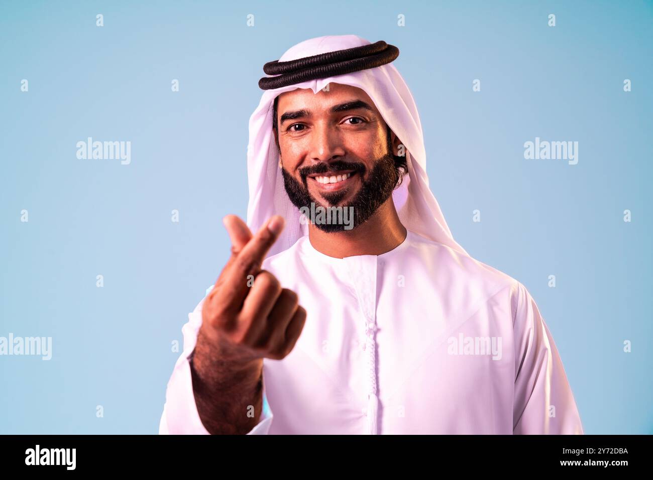 Arab businessman wearing emirati kandura portrait in studio in Dubai ...