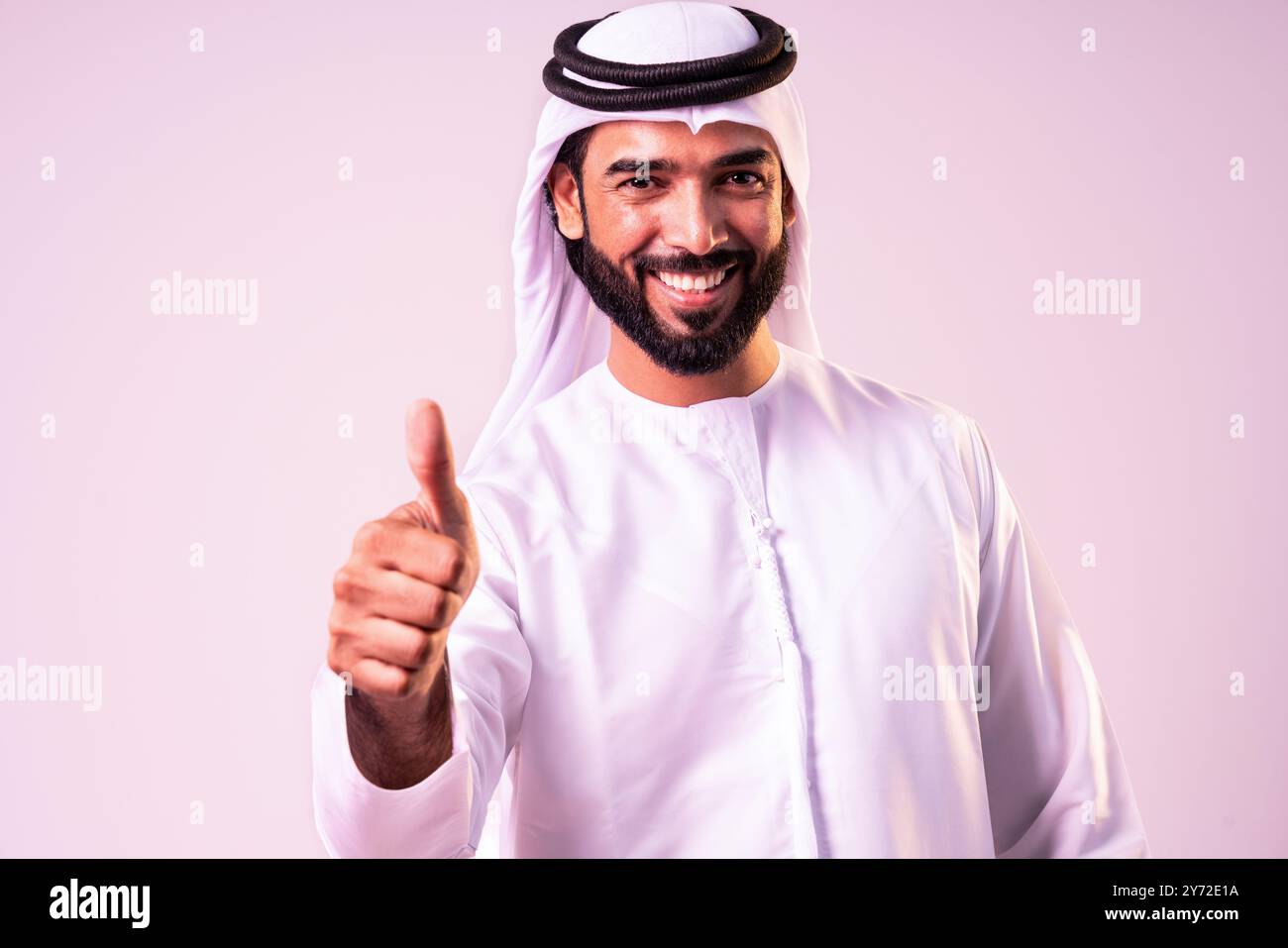 Arab businessman wearing emirati kandura portrait in studio in Dubai ...