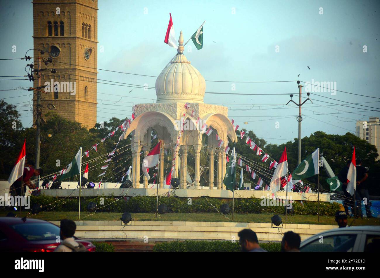 Karachi Press Club roundabout decorated with flags of Pakistan and ...