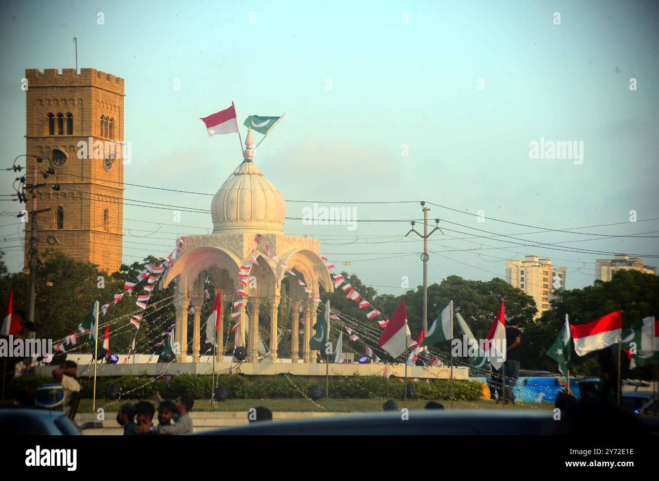 Karachi Press Club roundabout decorated with flags of Pakistan and ...