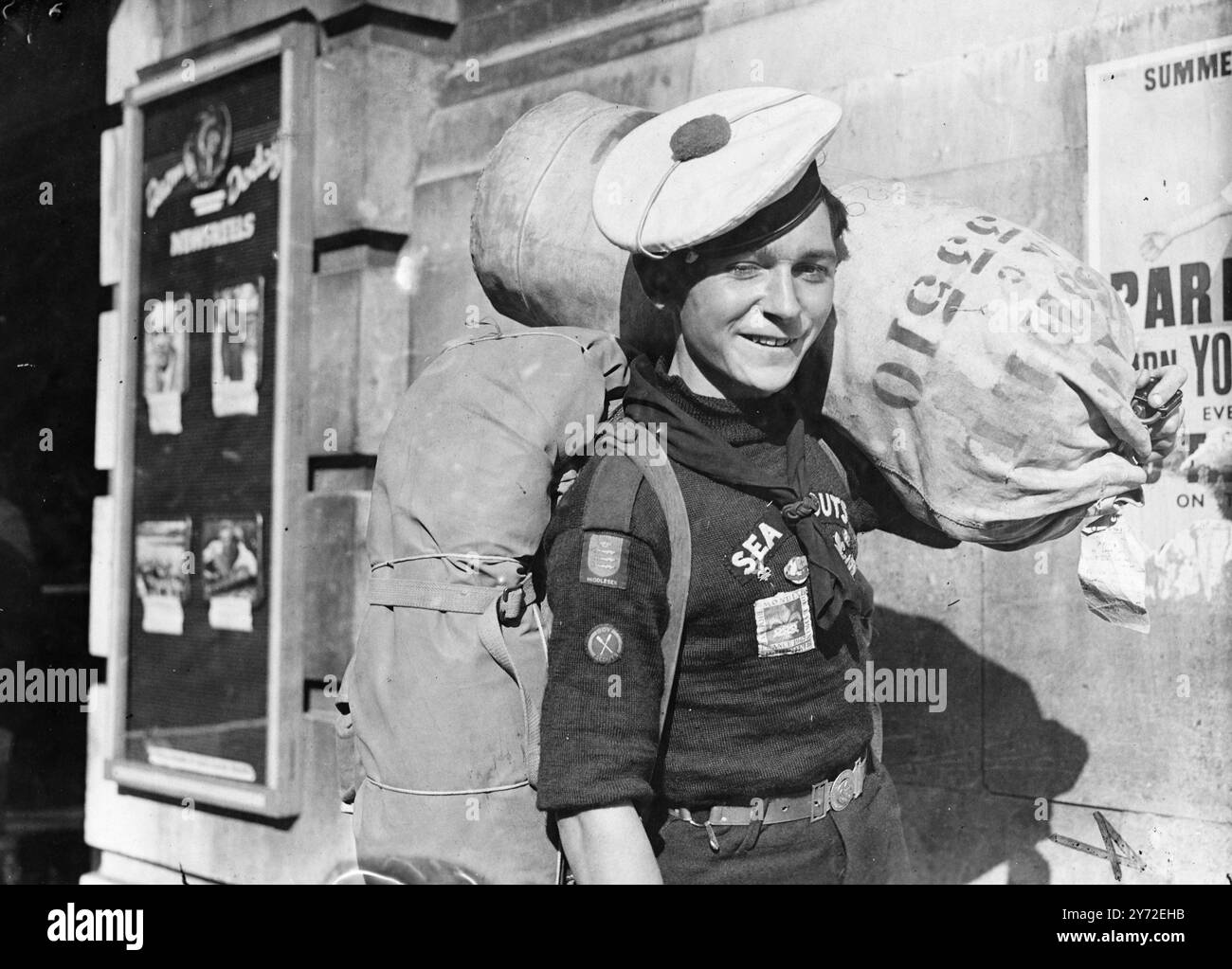 Wearing a French Sea Scouts Pom-pommed beret, scout Trevor Thomas, of ...