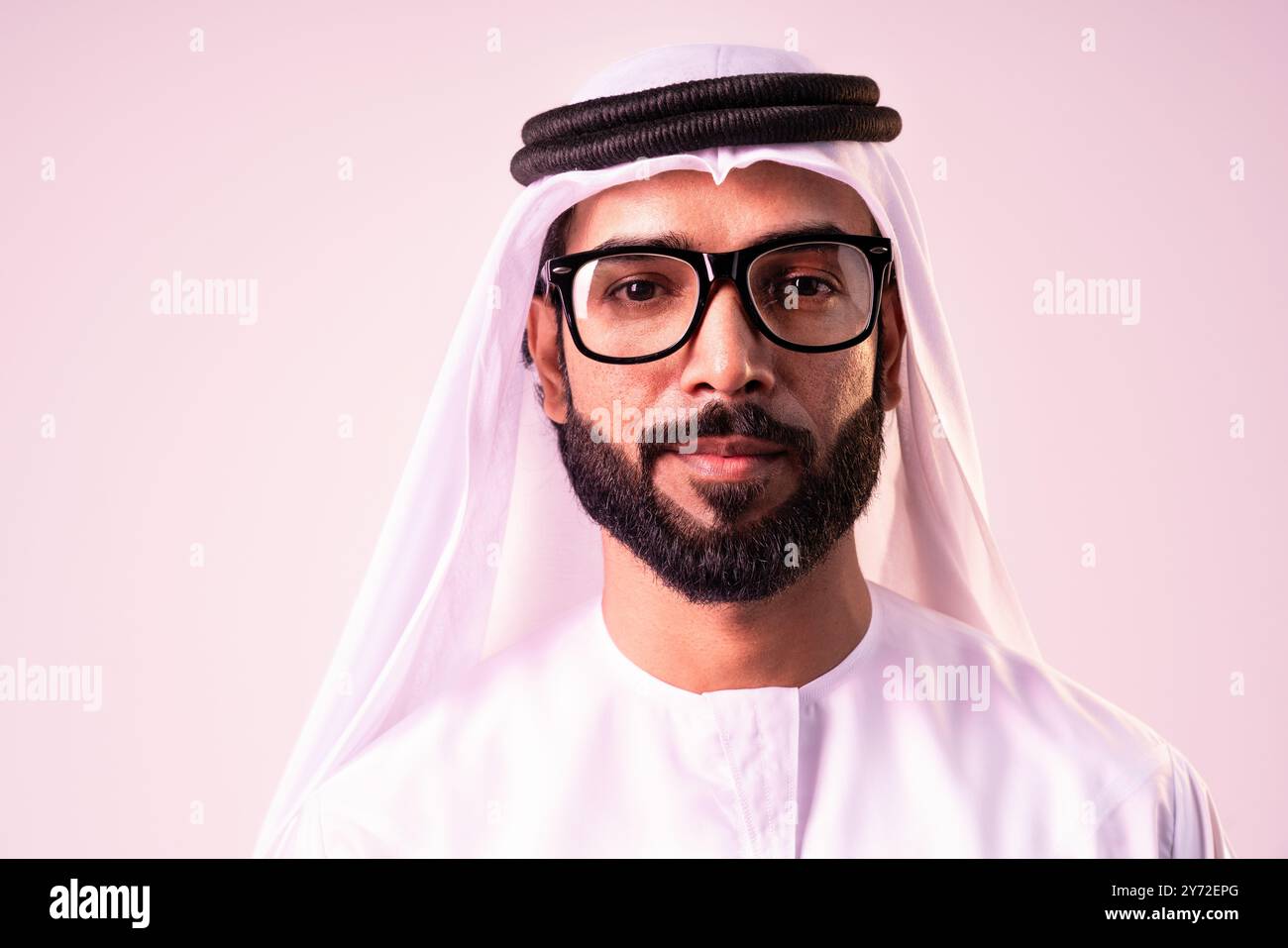 Arab businessman wearing emirati kandura portrait in studio in Dubai ...