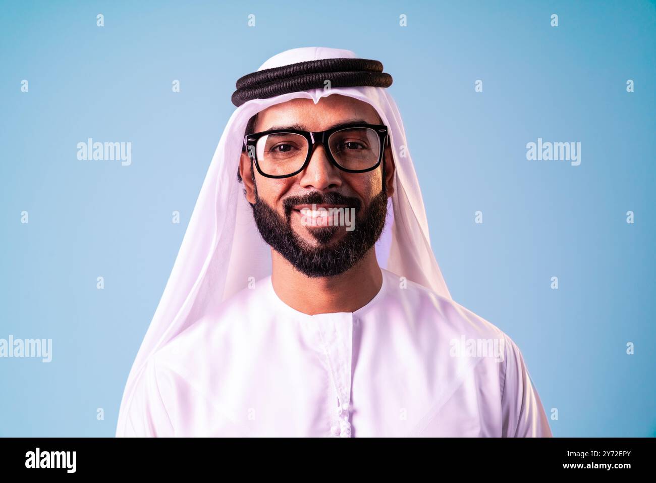 Arab businessman wearing emirati kandura portrait in studio in Dubai ...
