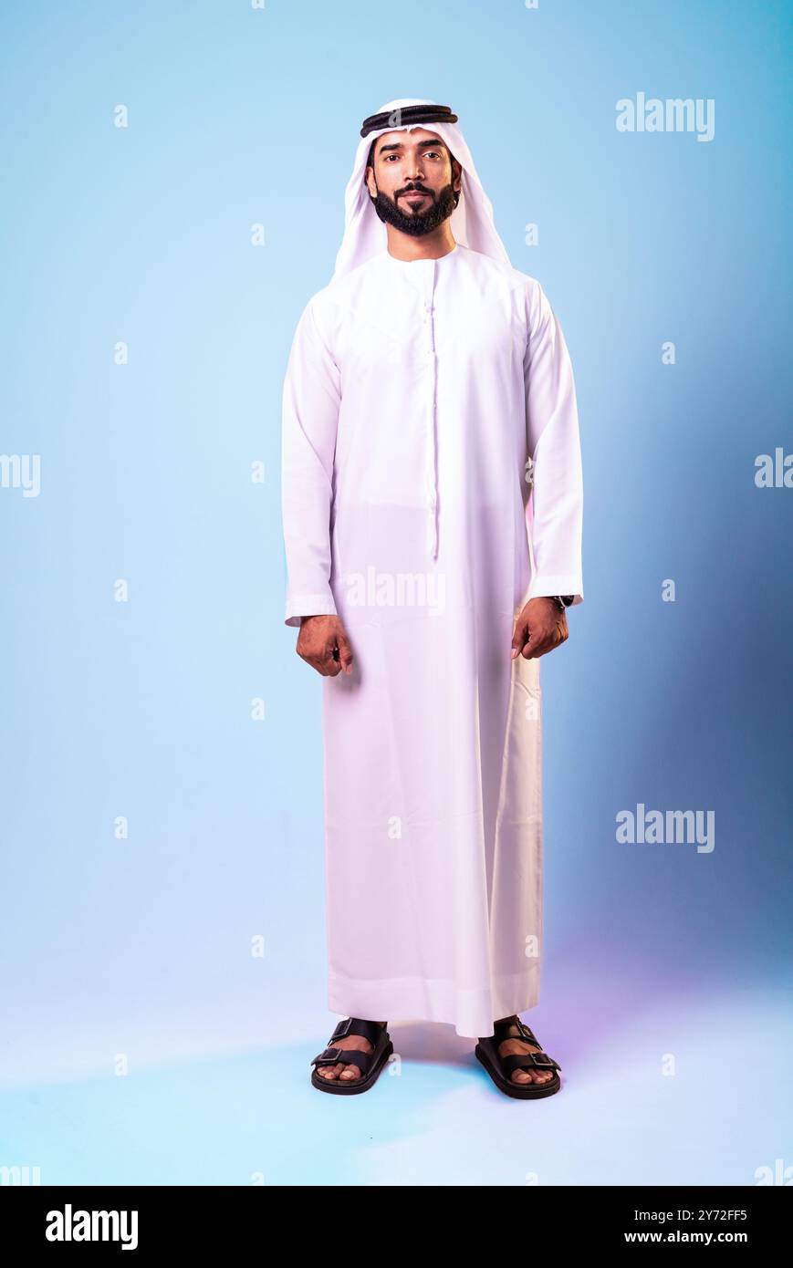 Arab businessman wearing emirati kandura portrait in studio in Dubai ...