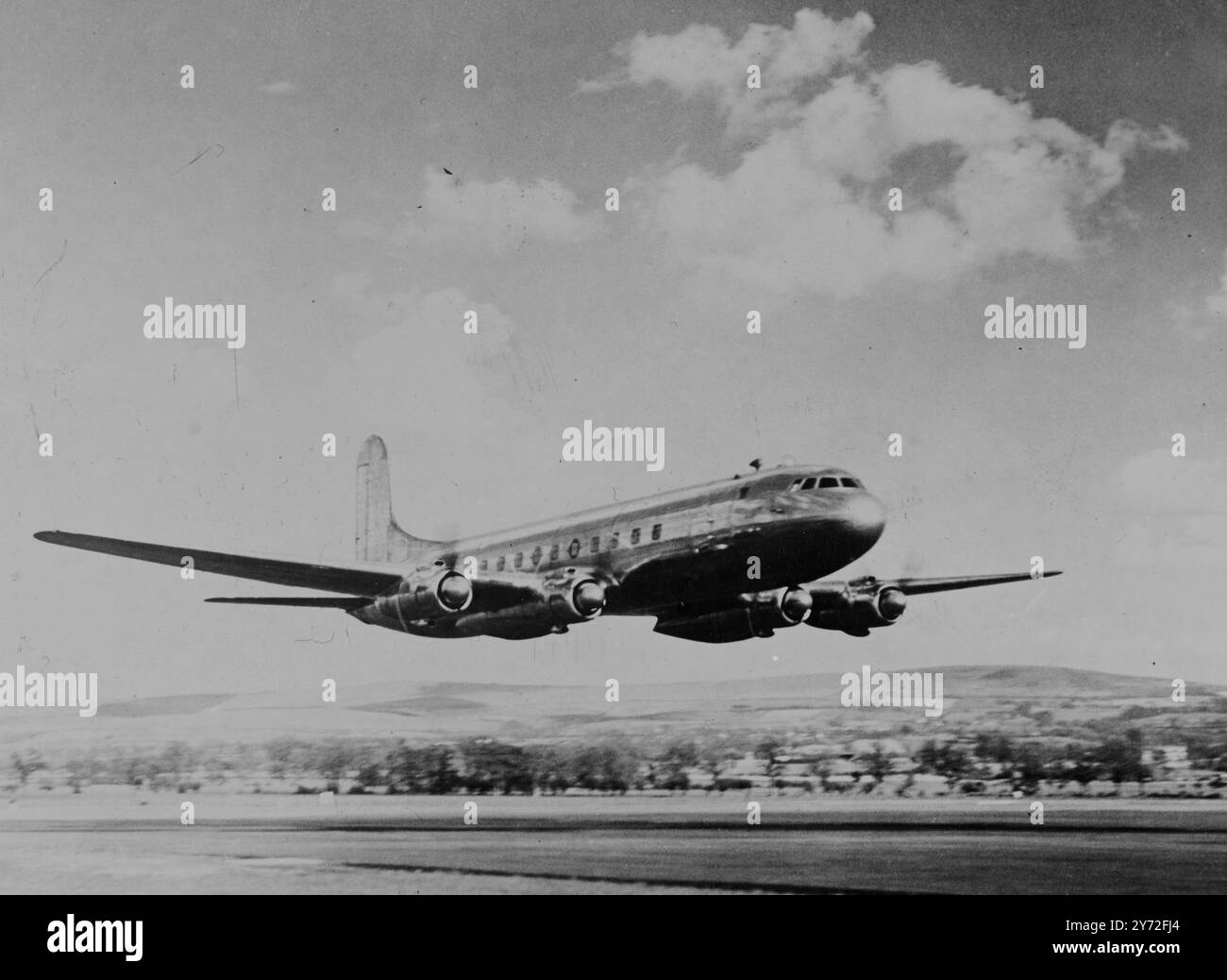 Britain's largest yet. Taking off on her trials from Woodford Aerodrome ...