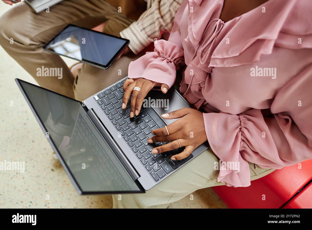 Top view of unrecognizable African American businesswoman typing on ...