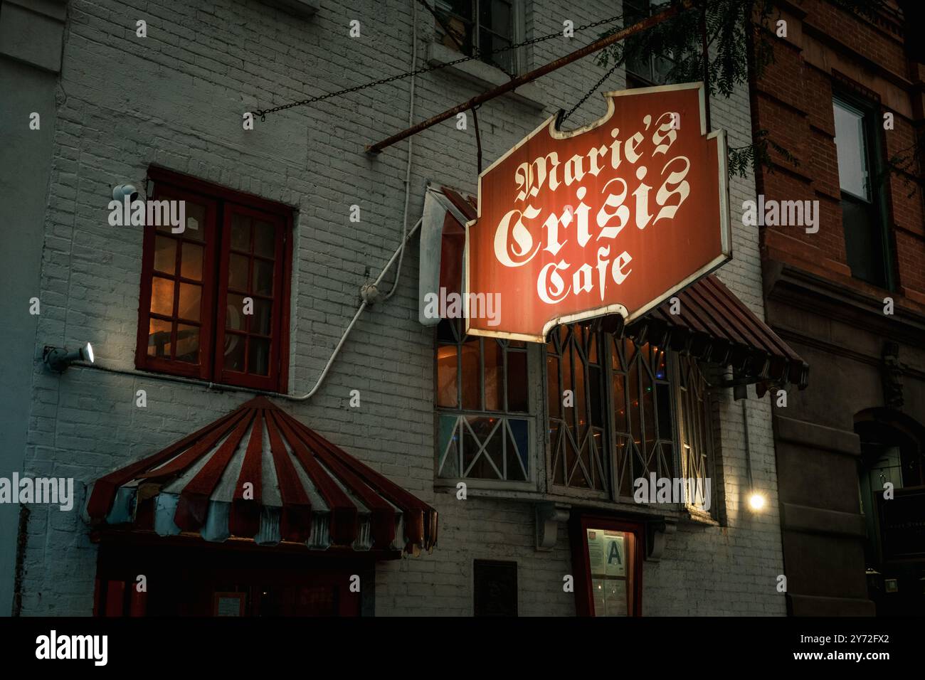 Maries Crisis Café vintage sign at night, in the West Village ...