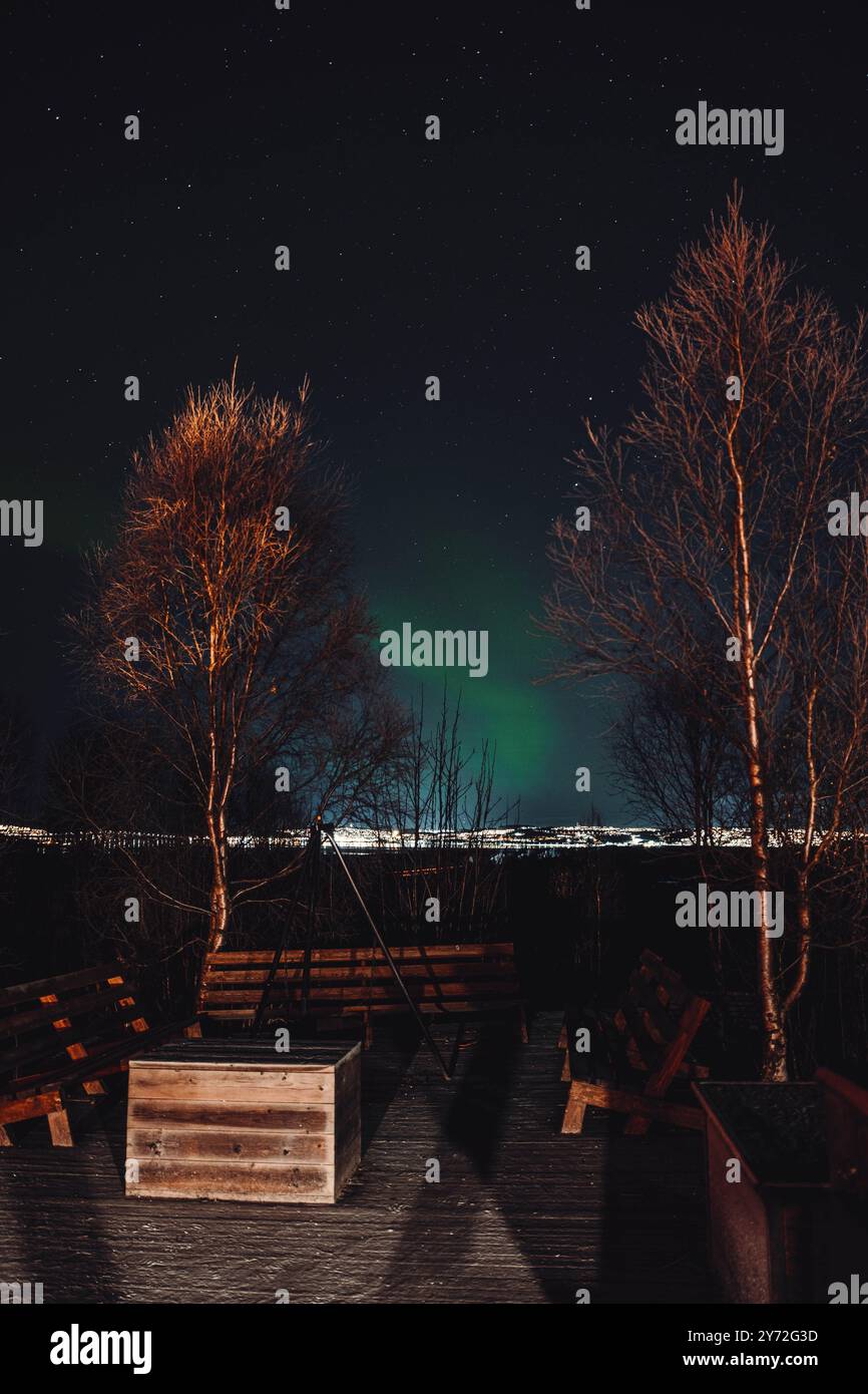 Aurora borealis over arctic landscape outside Tromso, Norway in autumn ...