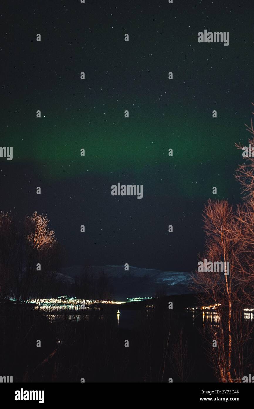 Northern lights above Tromso in the arctic circle in autumn in Norway ...