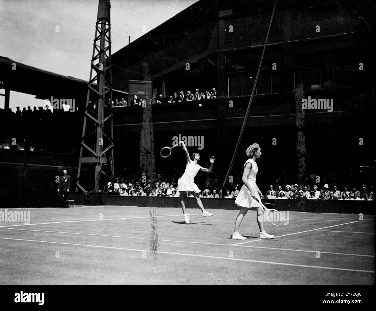 Pictured in play the ladies doubles at Wimbledon today are Mrs Muller ...