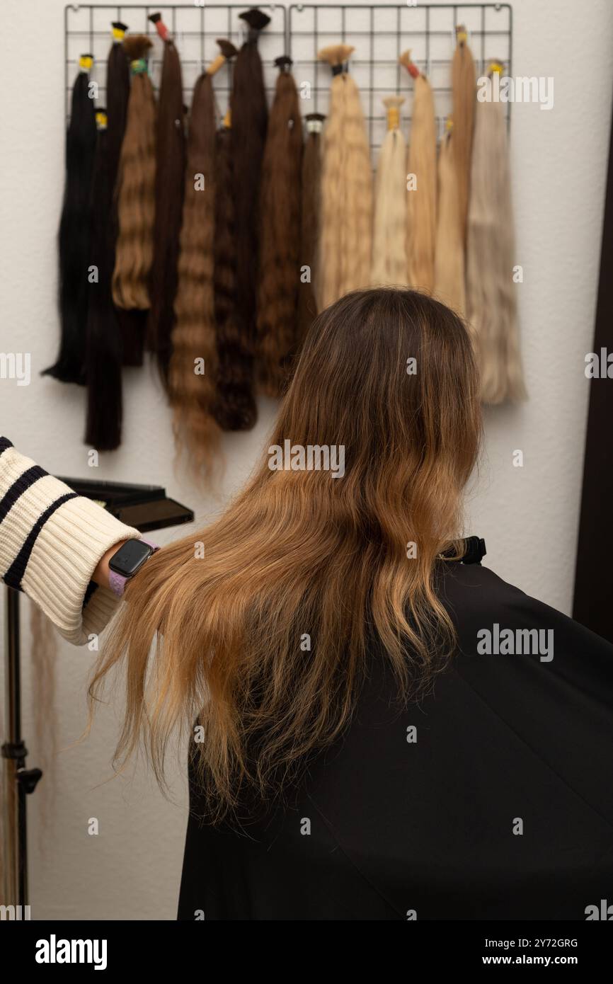 The process of hair extensions. Hair encapsulation. Beauty parlour ...
