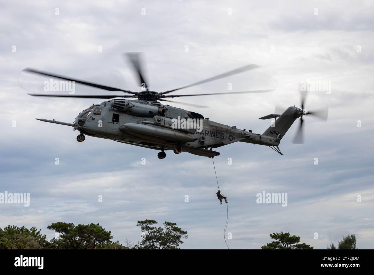 A U.S. Marine with III Marine Expeditionary Force conducts rappelling ...