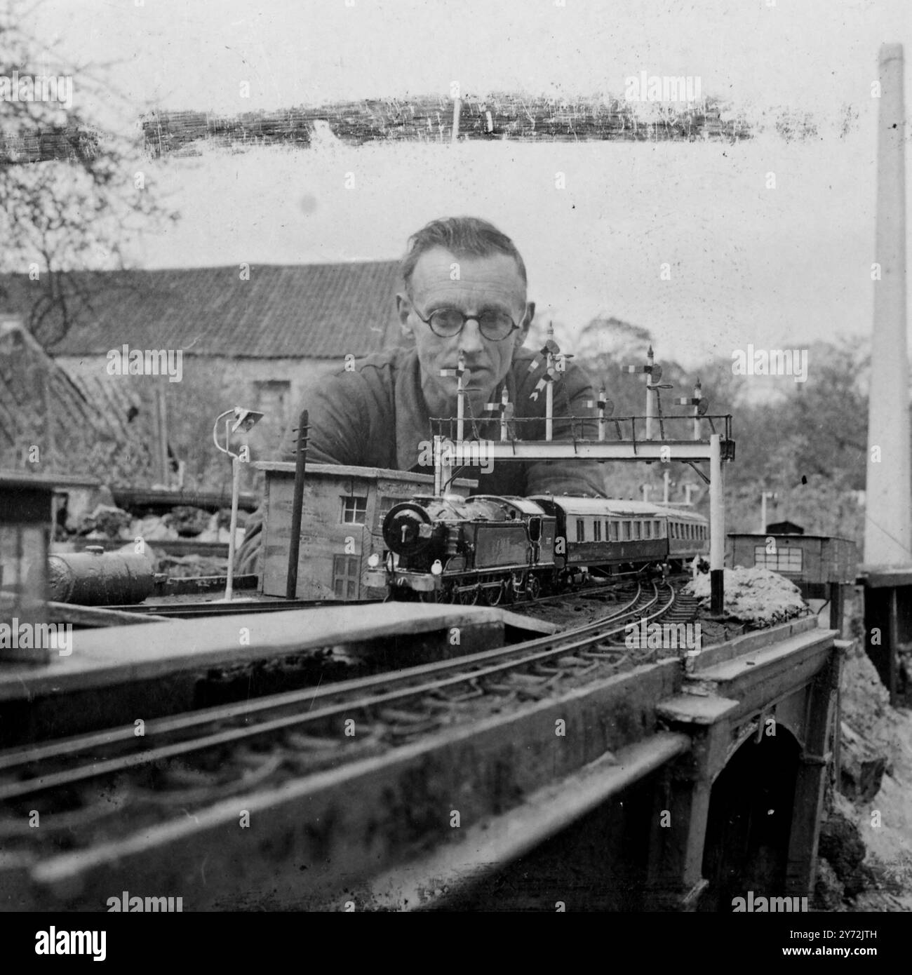 Engeneer Mr F.W. Stephens sees a model train into the station at his ...