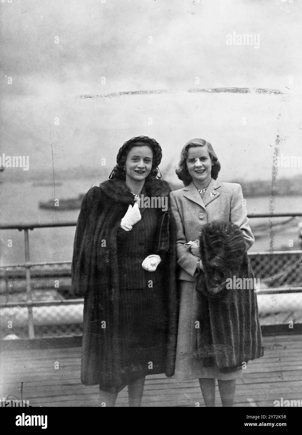 Martha Firestone, pictured with her sister Elizabeth (left) on arrival ...