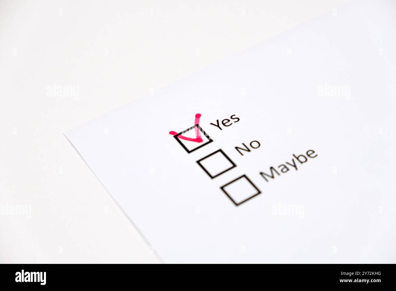mark Yes checkbox with red on checklist on white paper Stock Photo - Alamy