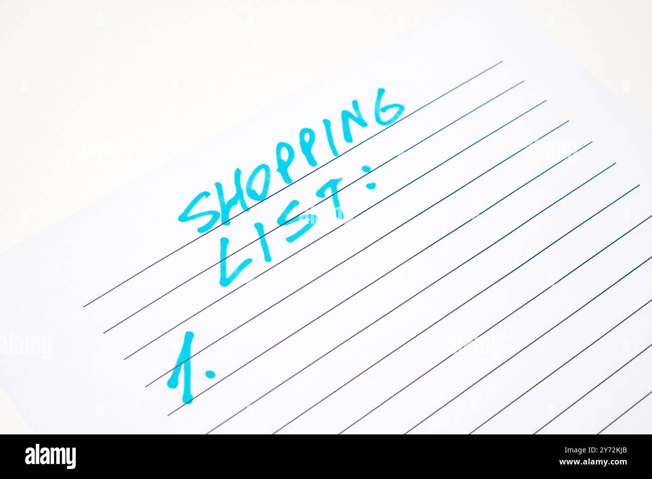 Shopping list handwritten inscription in blue on white paper Stock ...