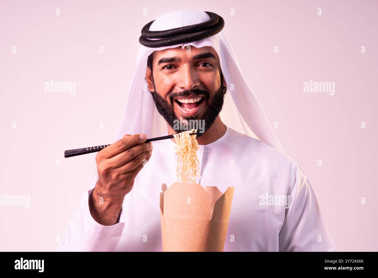 Arab businessman wearing emirati kandura portrait in studio in Dubai ...