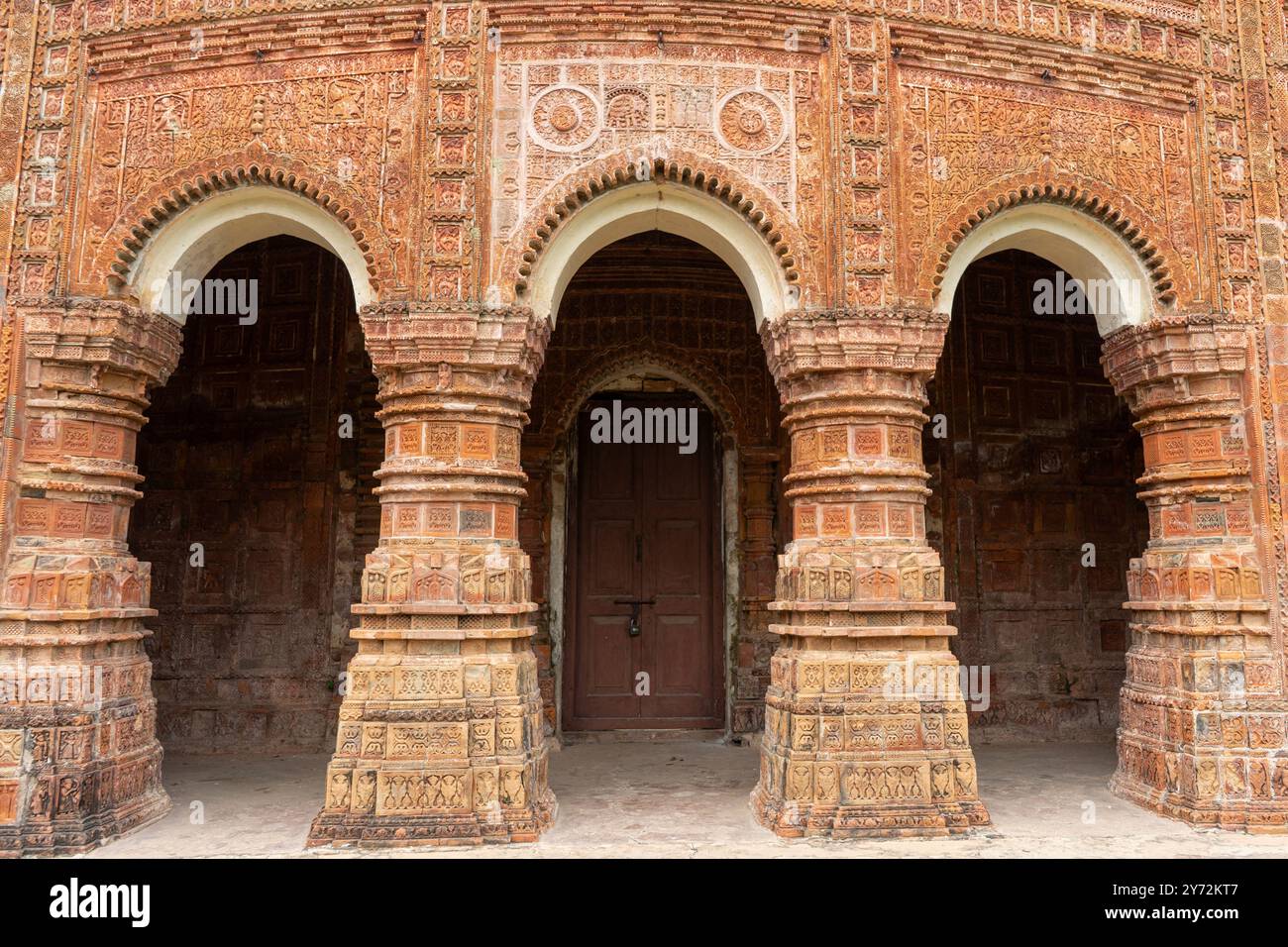 Entrance arch columns decorated with terracotta carvings in Pancha ...
