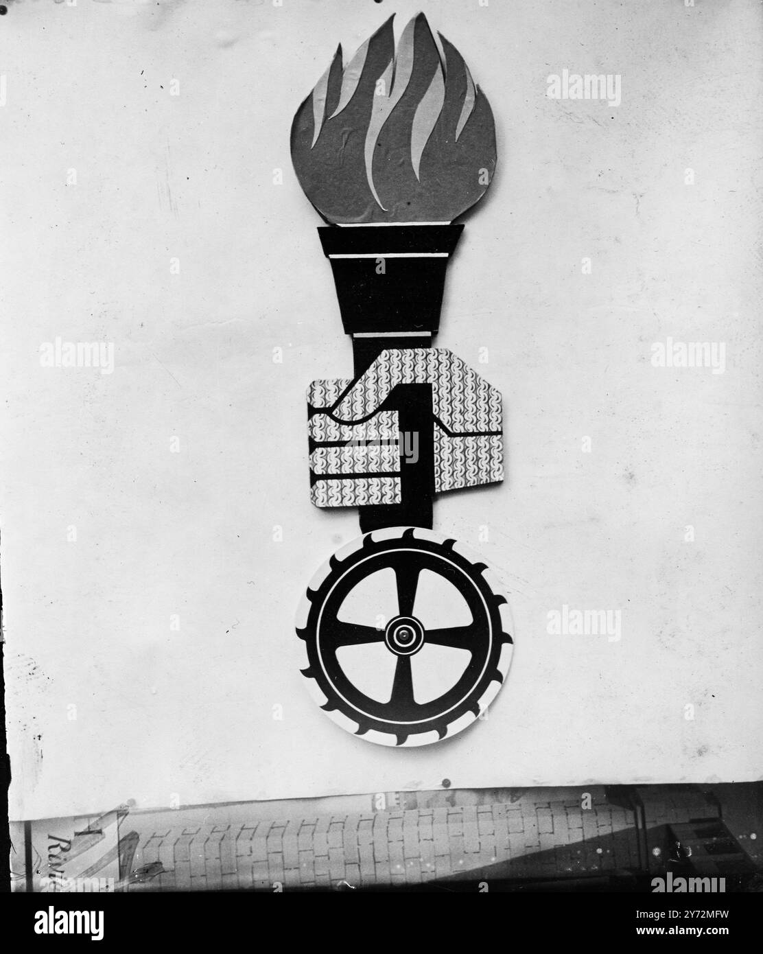 The blazing torch, then mailed fist and the moving wheel make up the ...