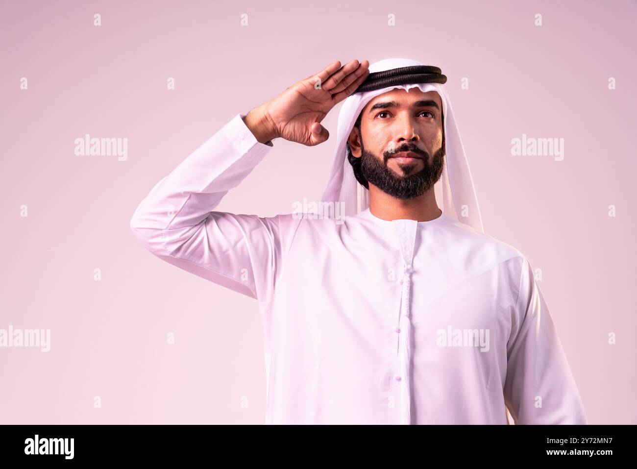 Arab businessman wearing emirati kandura portrait in studio in Dubai ...