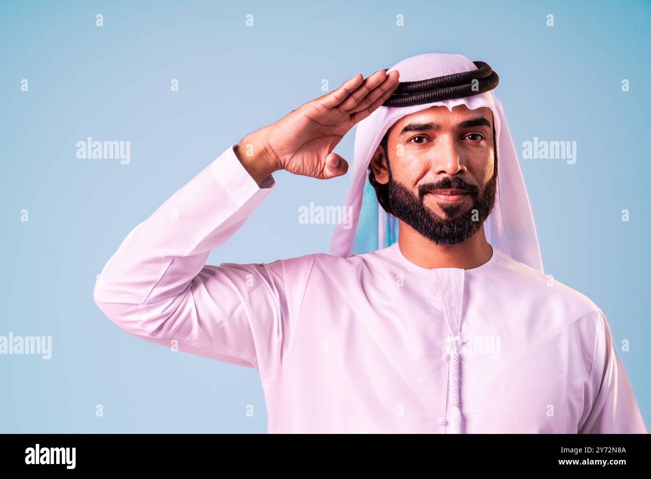 Arab businessman wearing emirati kandura portrait in studio in Dubai ...