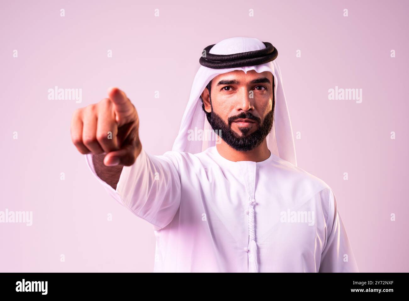 Arab businessman wearing emirati kandura portrait in studio in Dubai ...