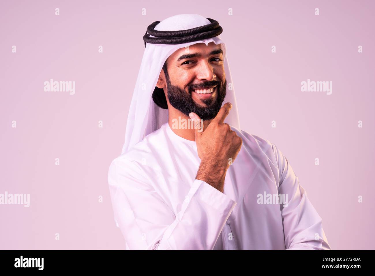 Arab businessman wearing emirati kandura portrait in studio in Dubai ...