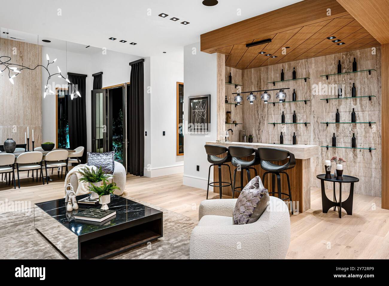 Modern living room with a stylish bar area, contemporary furniture, and ...
