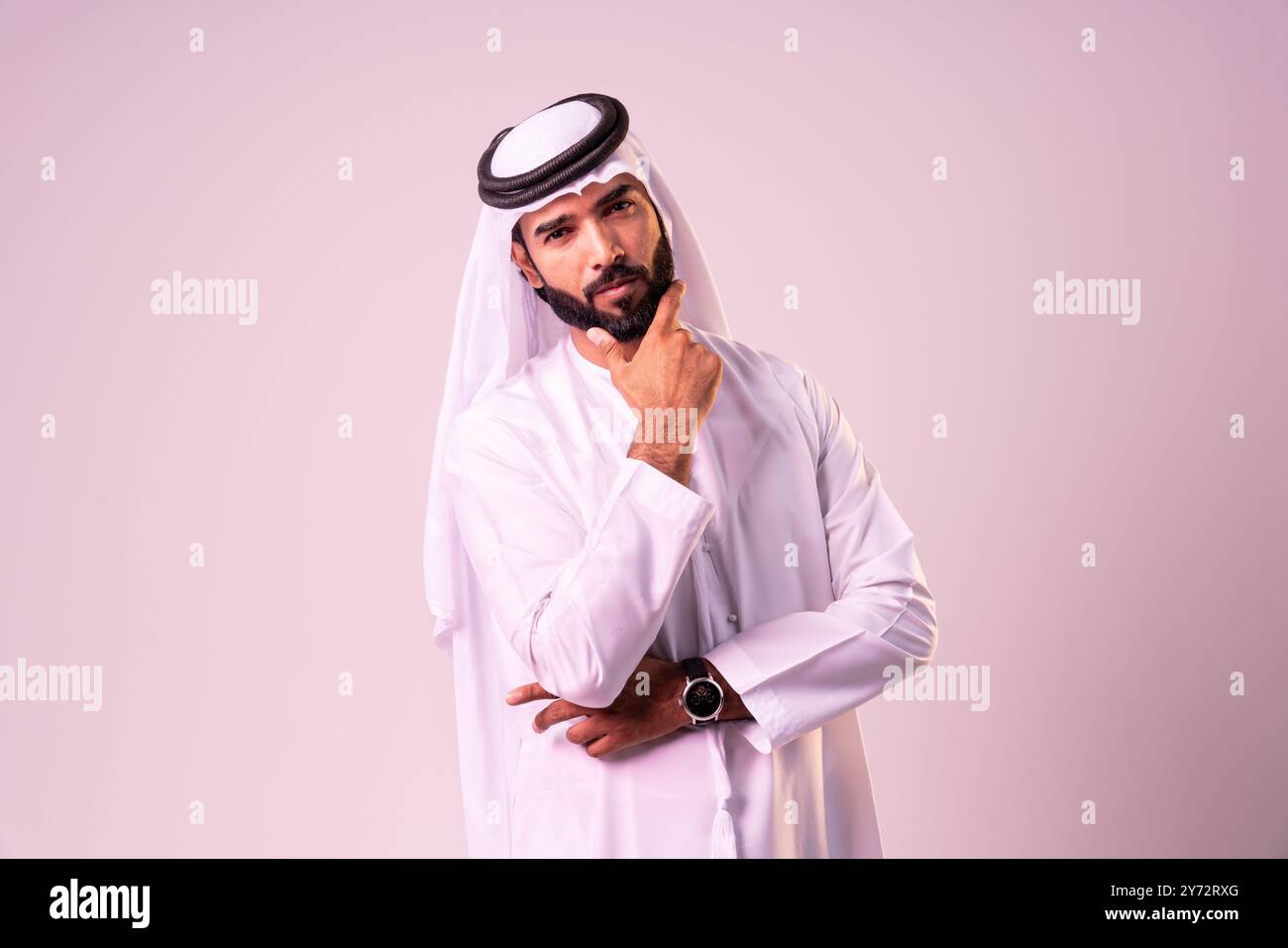 Arab businessman wearing emirati kandura portrait in studio in Dubai ...