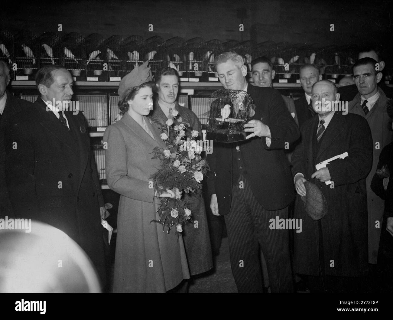 Princess Elizabeth is shown an exhibit by Mr. J. C. Lynch one of the ...
