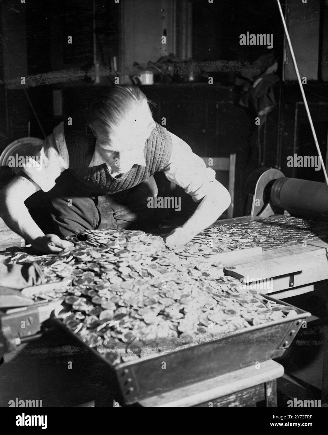 At the Mint, London, Britain's new coins are being minted. These will ...