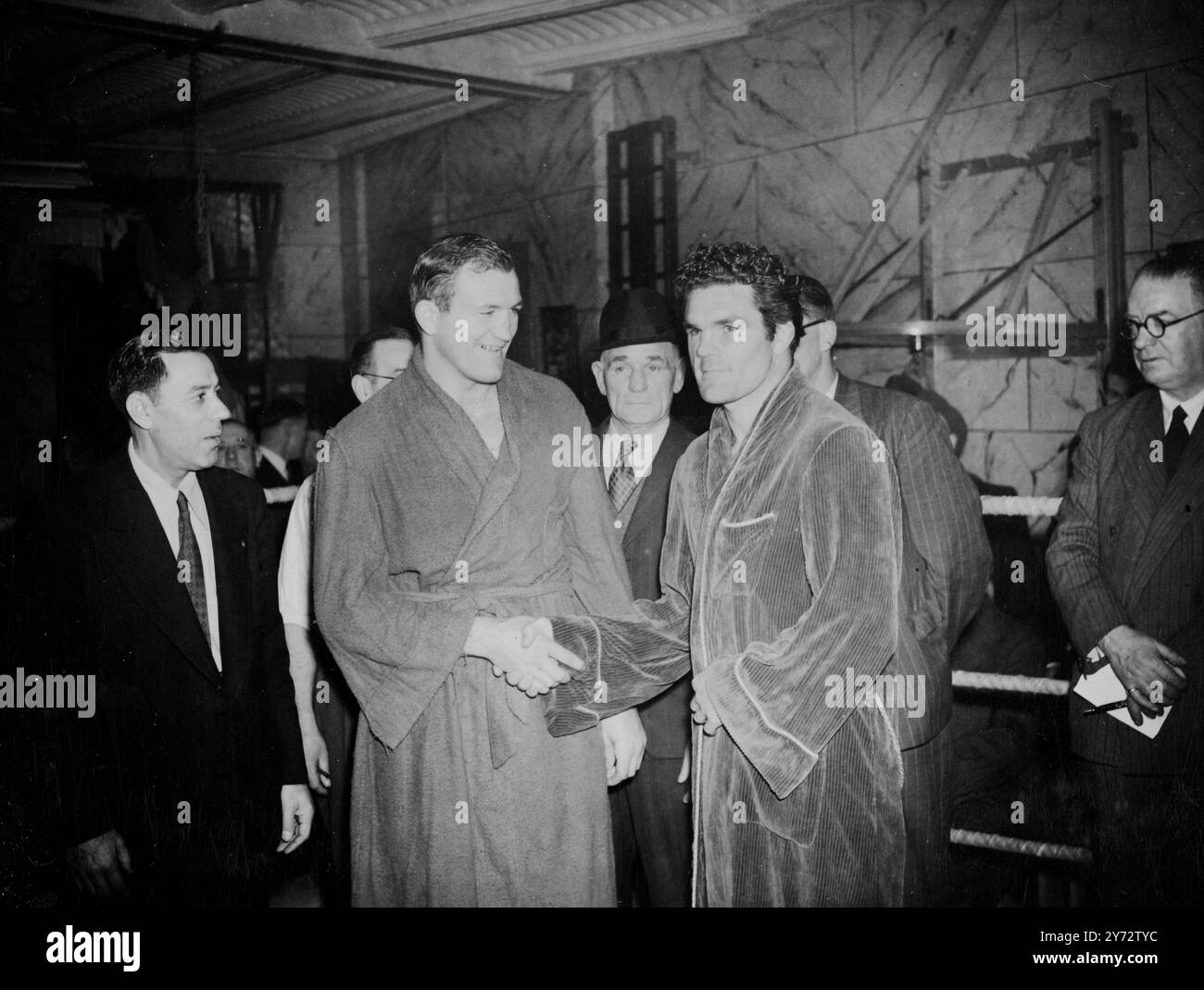 Joe Baksi (left) and Freddie Mills seen shaking hands at a weigh-in at ...
