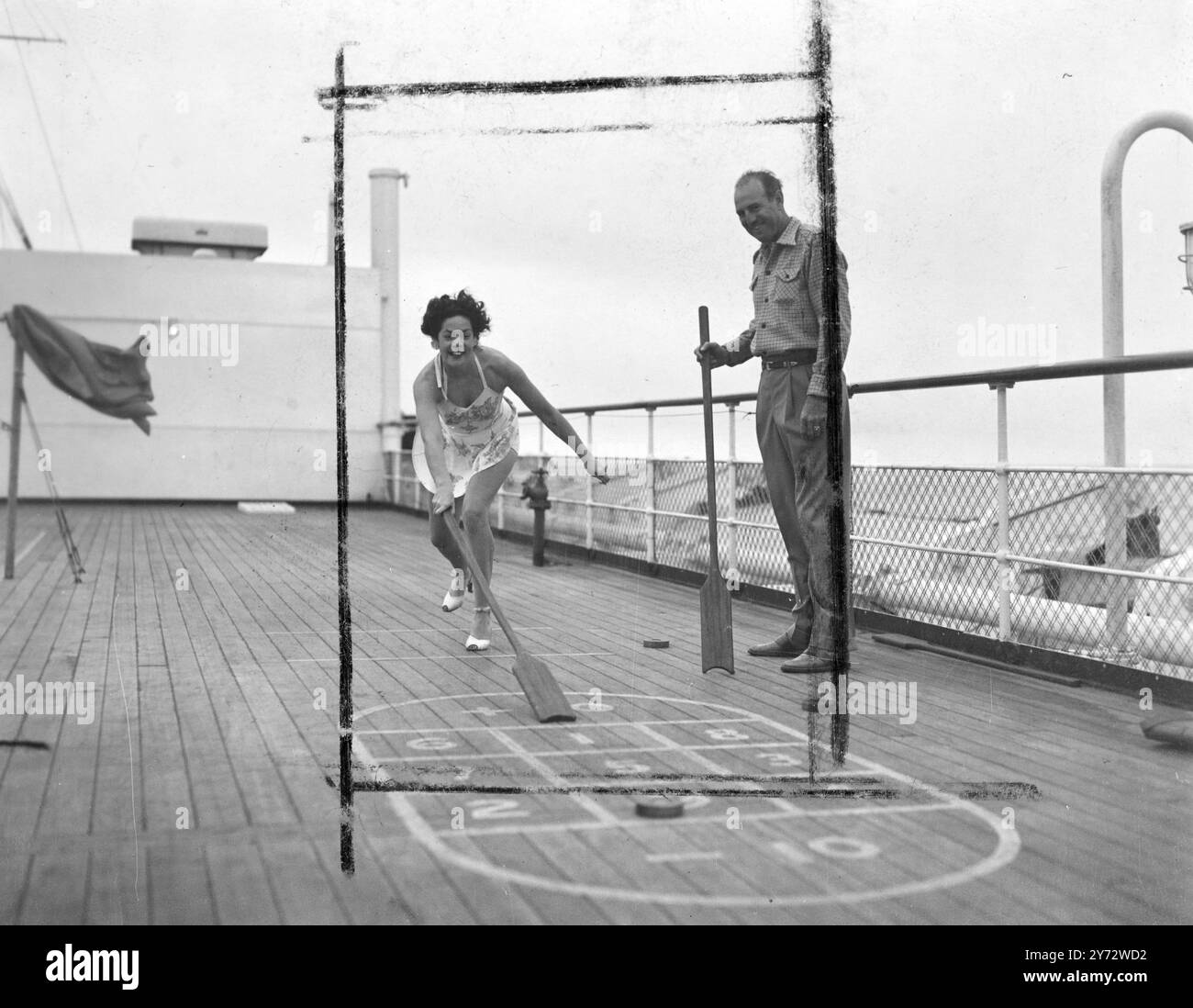 Passengers on the maiden voyage of the RMS "Queen Elizabeth" luxury ...