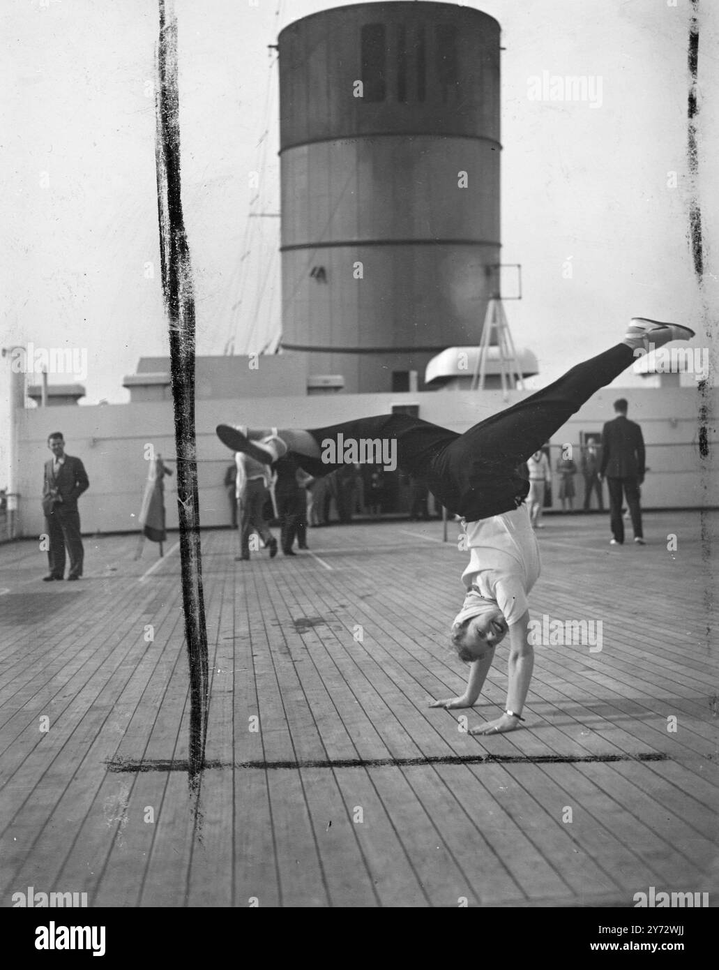 Passengers on the maiden voyage of the RMS "Queen Elizabeth" a luxury ...
